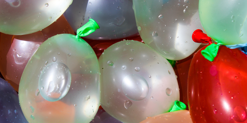 Setting up a trampoline obstacle course challenge for your kids.